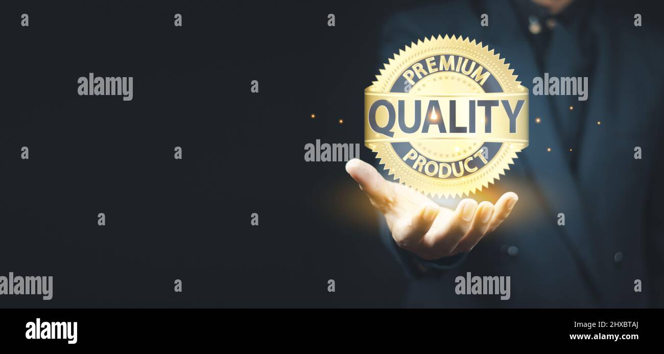 Quality product symbol in the hand of a business man.Hand shows the ...