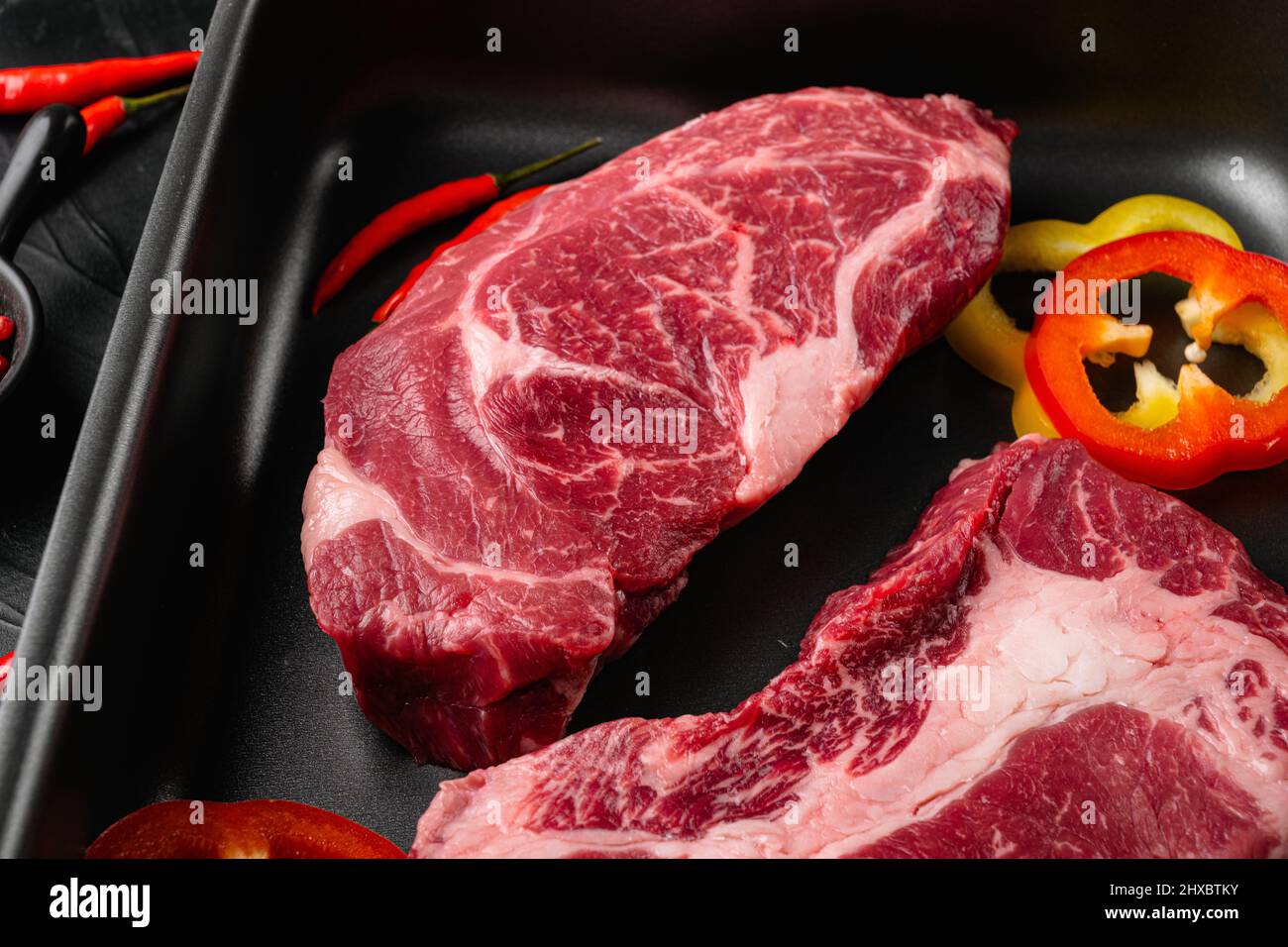 Black Angus Prime raw beef steak Chuck eye roll, on black dark stone ...