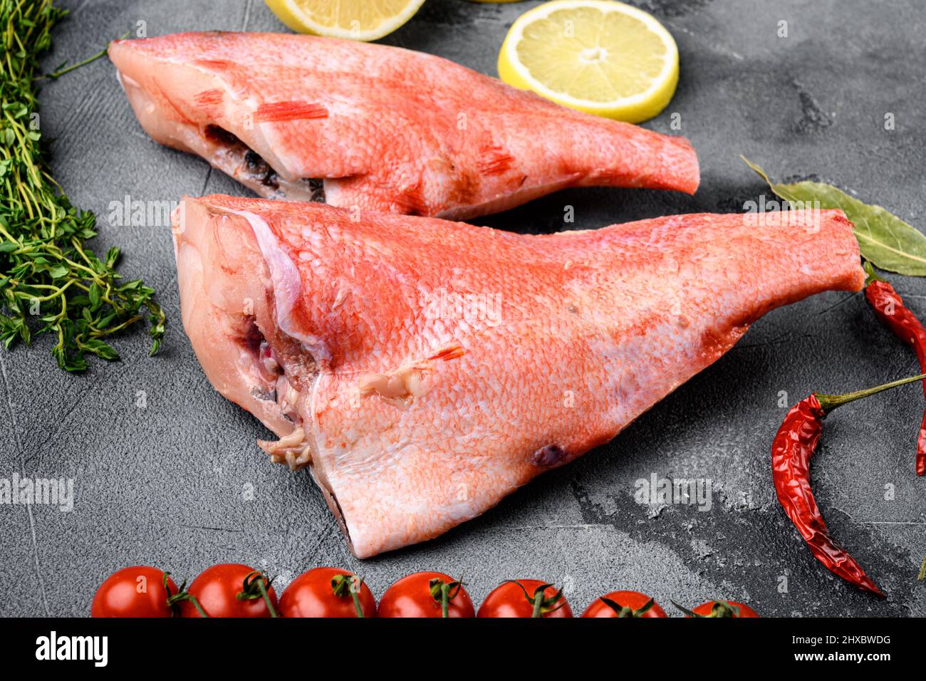 Whole raw red snapper fish, on gray stone table background Stock Photo ...