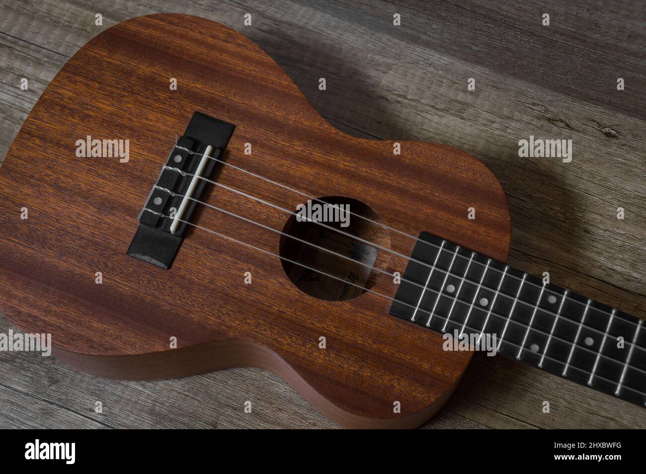 Ukulele on wood background Stock Photo - Alamy