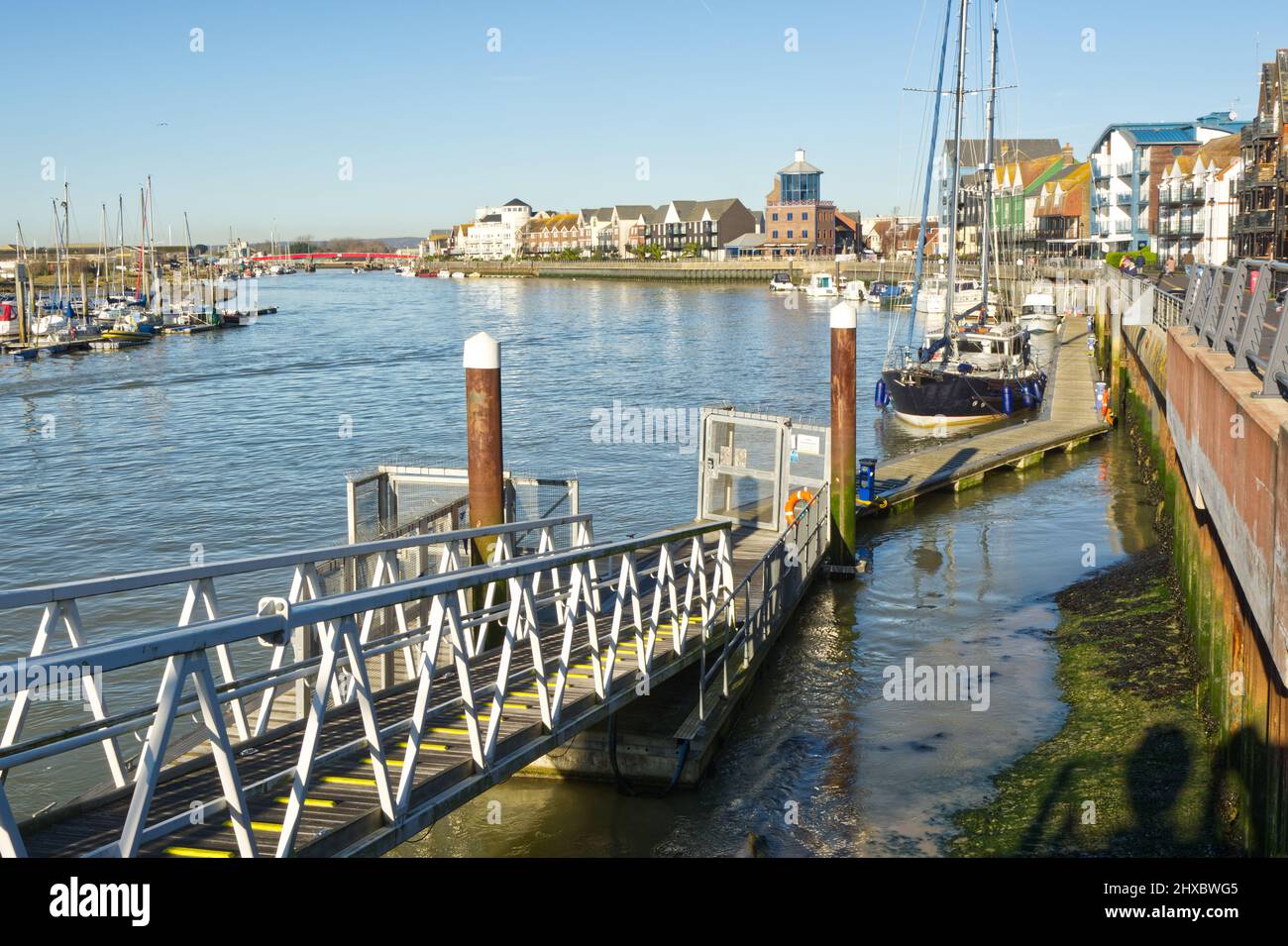 Riverside promenade and boat moorings at Littlehampton harbour in West ...
