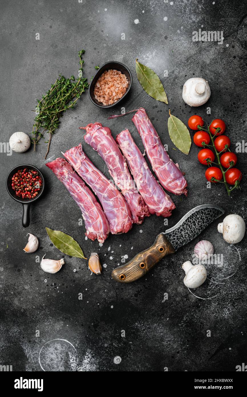Raw chicken neck, on black dark stone table background, top view flat ...