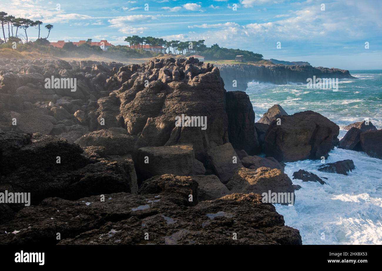 Rocky cliffs below the coastal path in Noja, Cantabria, Spain Stock ...