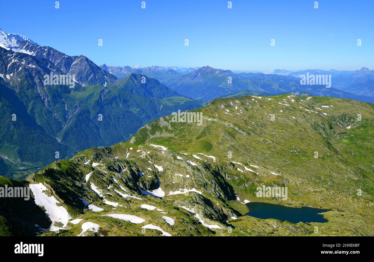 View from top of mountain Le Brevent on the lake Lac du Brevent. French ...