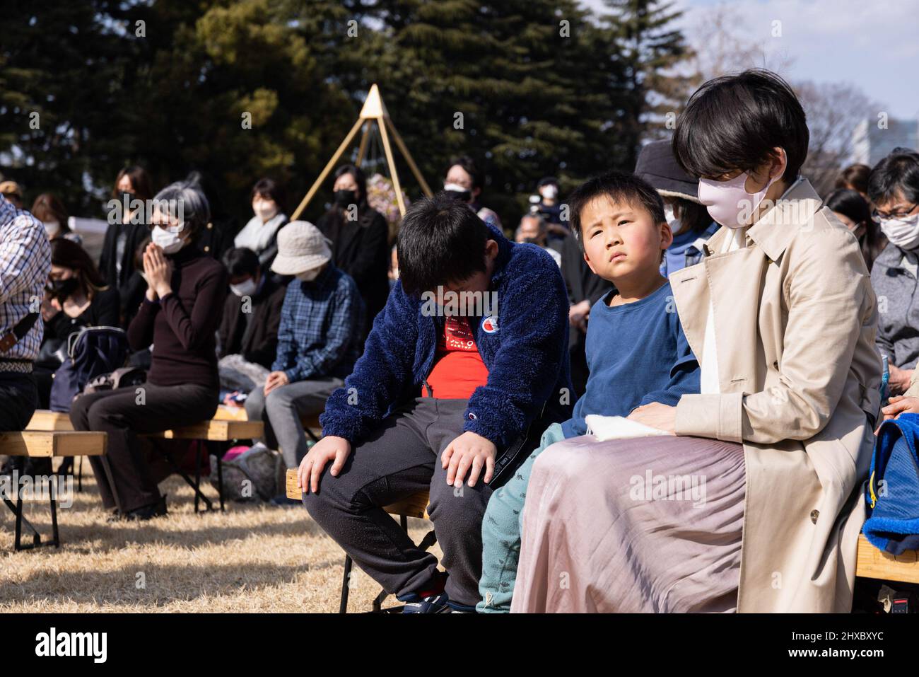 Tokyo, Japan. 11th Mar, 2022. People offer prayers during the memorial ...