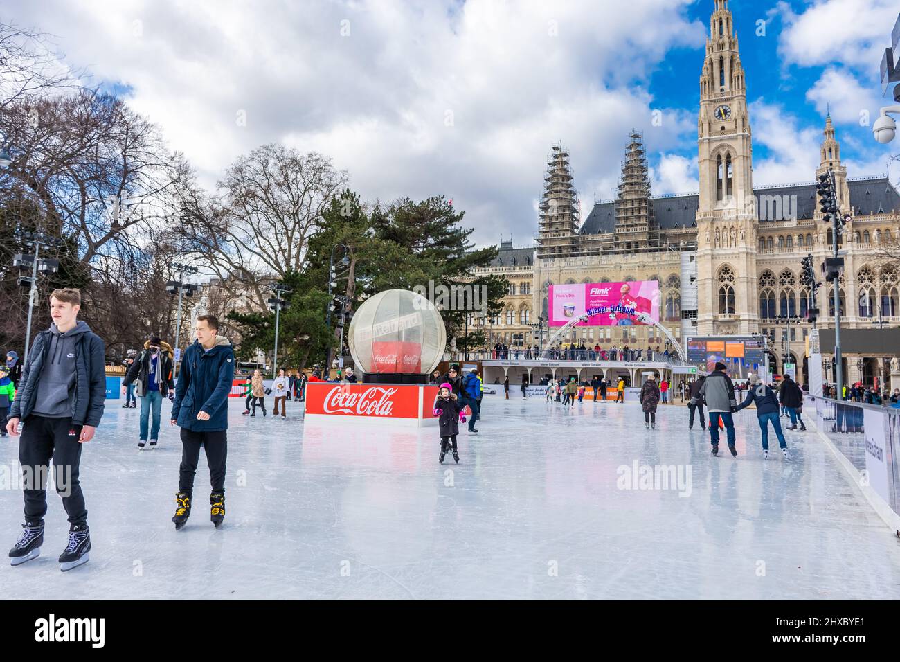 VIENNA, AUSTRIA, 19 FEBRUARY 2022: People ice skating in front of the ...