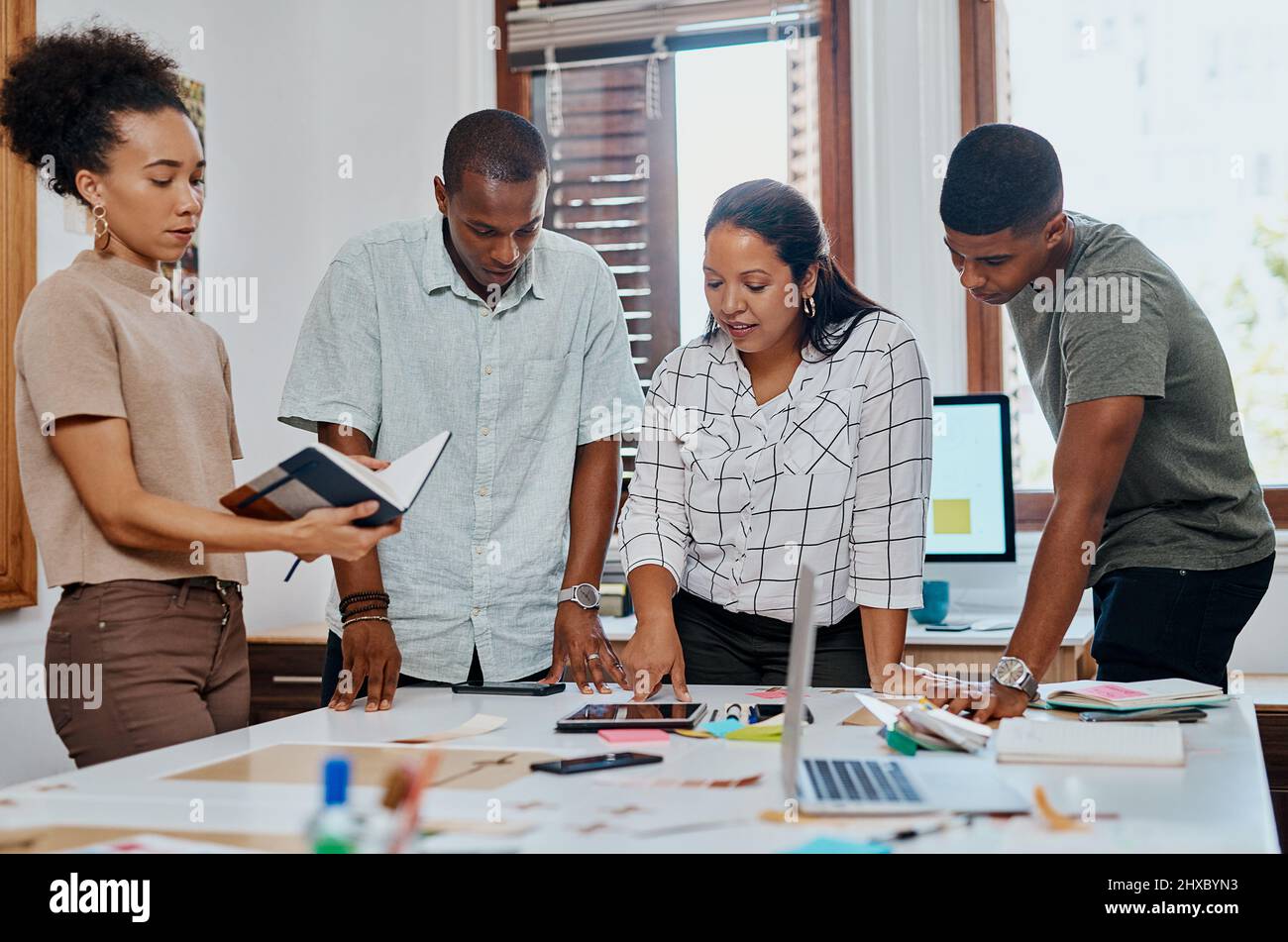 Making productivity their number one priority. Shot of a group of young ...