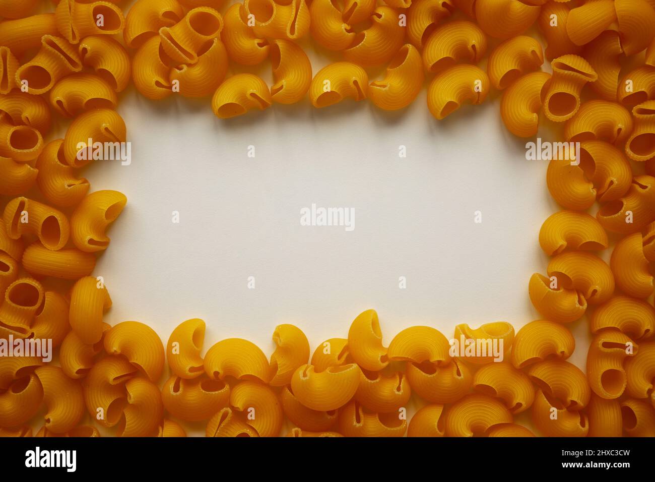 Raw organic elbow macaroni hi-res stock photography and images - Alamy