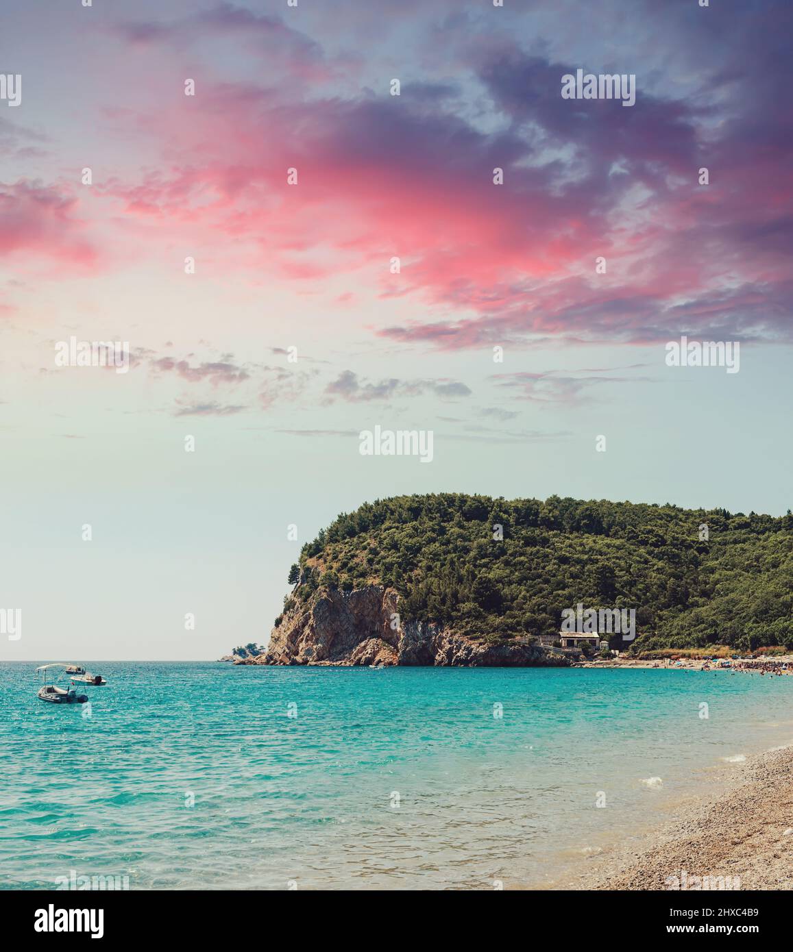 Picturesque view on rocks on a sunny day from the sea. Budva riviera ...