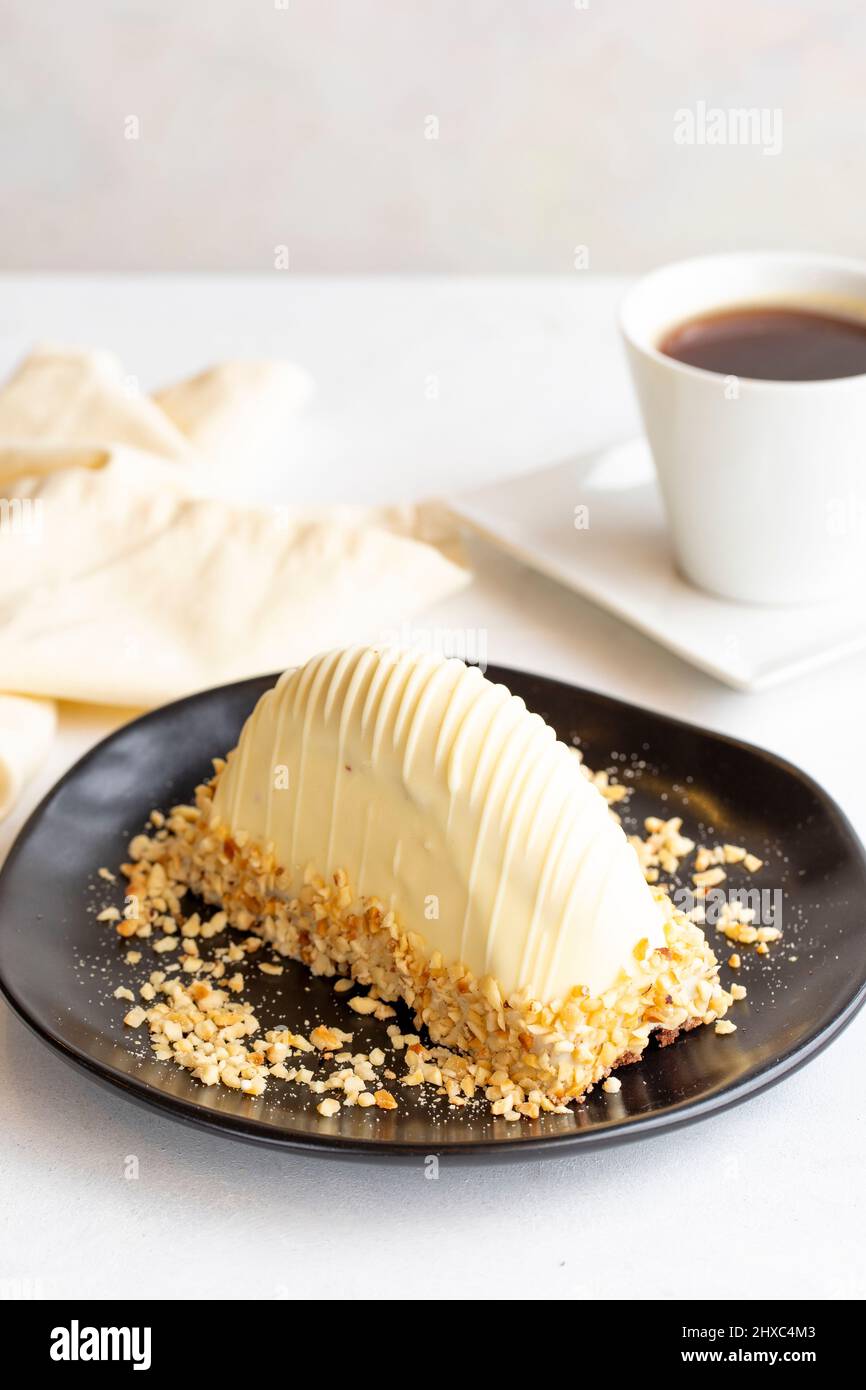 Banana cake with white chocolate on a white background. Fruity malaga ...