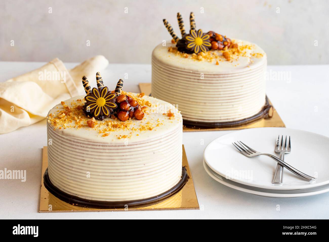 Celebratory cake with white chocolate croquant on a white background ...