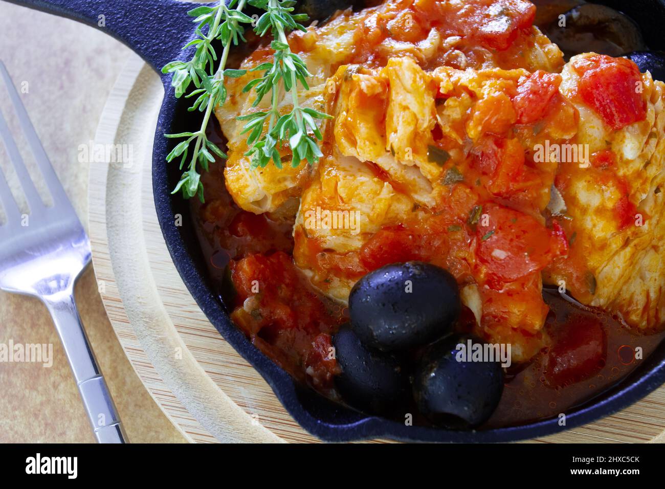 White fish fillet Provencal style Stock Photo - Alamy