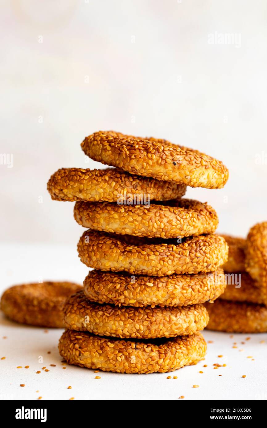 Turkish Bagel Kandil simit (stack of pastry). sesame bagel on a white ...