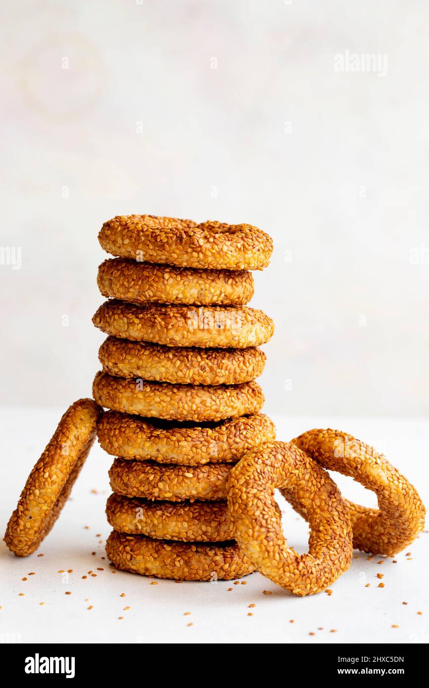 Turkish Bagel Kandil simit (stack of pastry). sesame bagel on a white ...