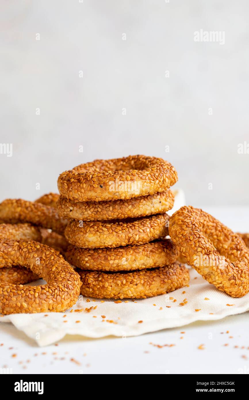 Turkish Bagel Kandil simit (stack of pastry). sesame bagel on a white ...