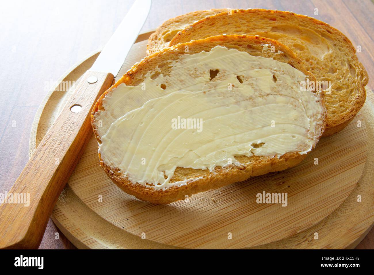 slice of buttered bread Stock Photo - Alamy