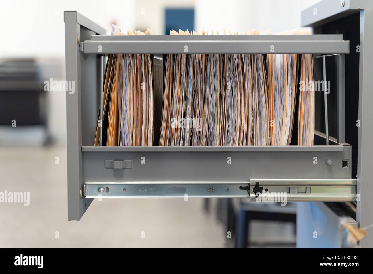 Hanging files in filling cabinet in an office at work Stock Photo - Alamy