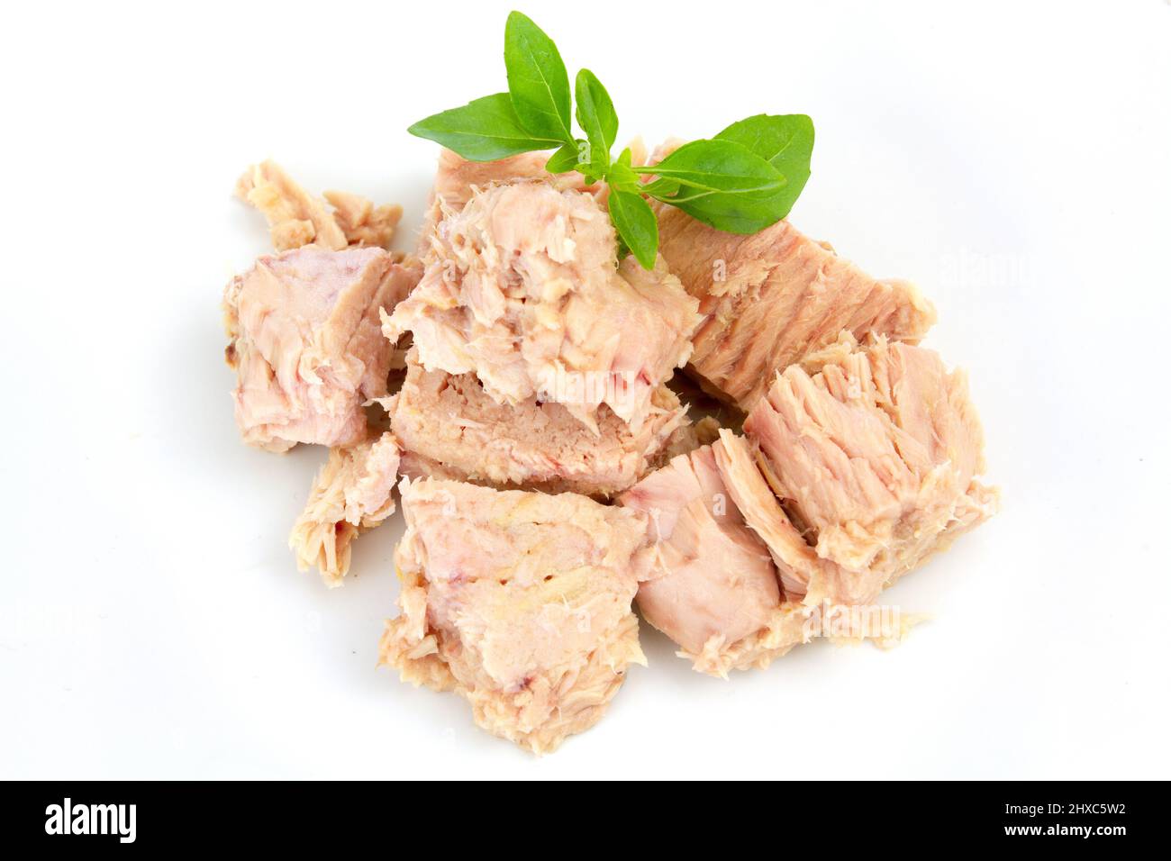 natural tuna crumb isolated on a white background Stock Photo - Alamy