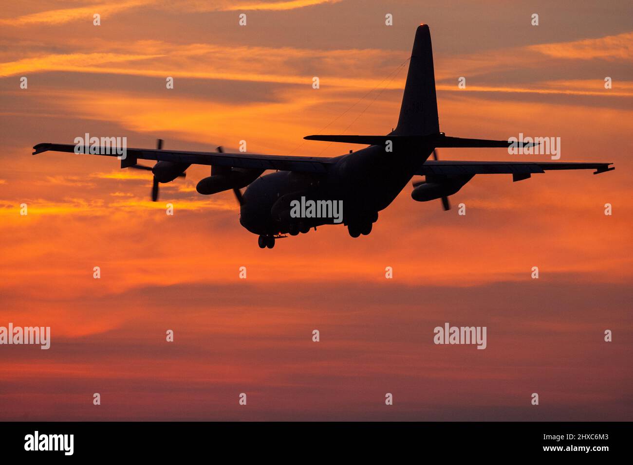 C-130 Hercules during a sunset landing at Eindhoven airport Stock Photo ...
