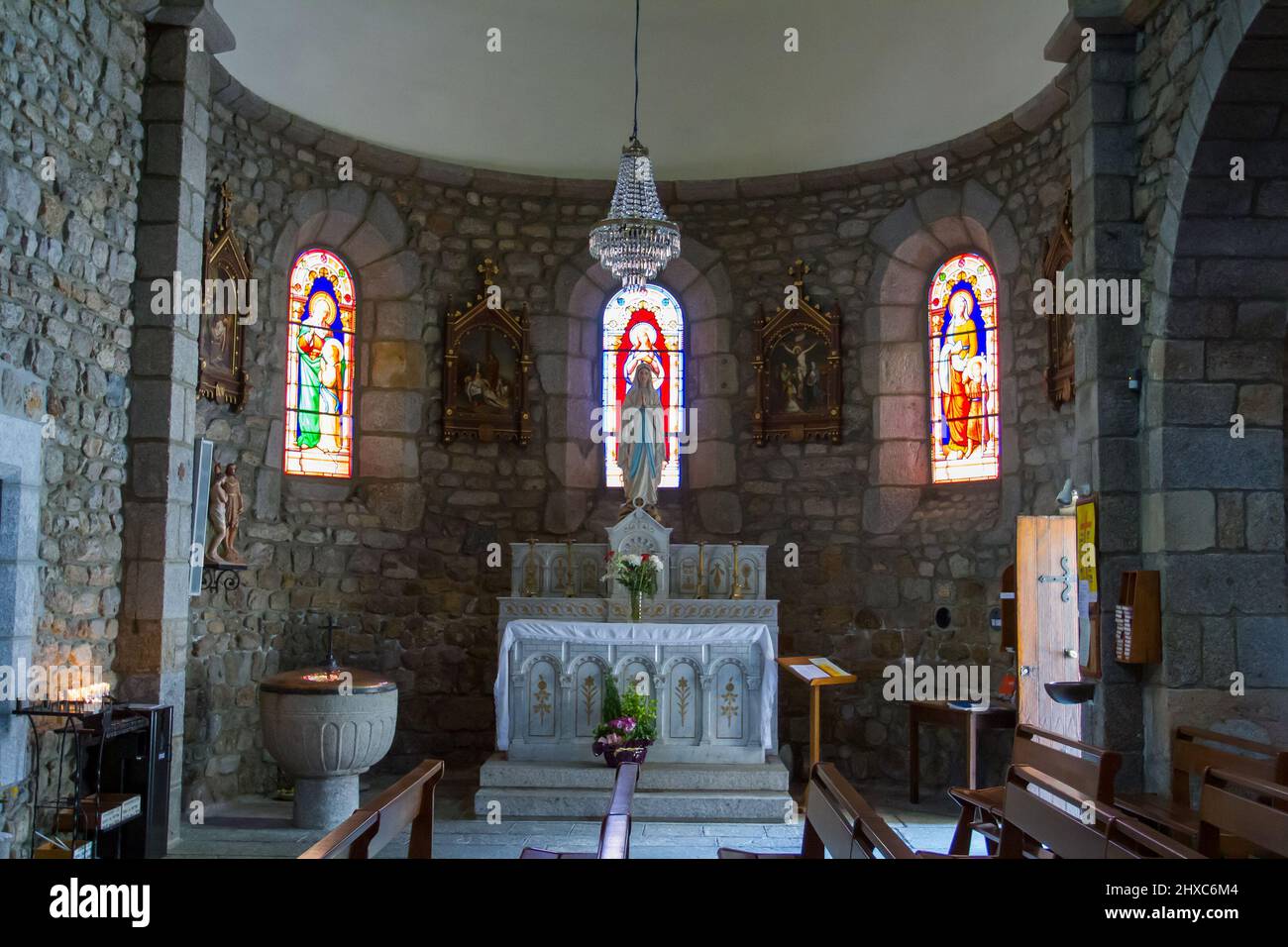 interior of a church with statues and stained glass windows Stock Photo ...
