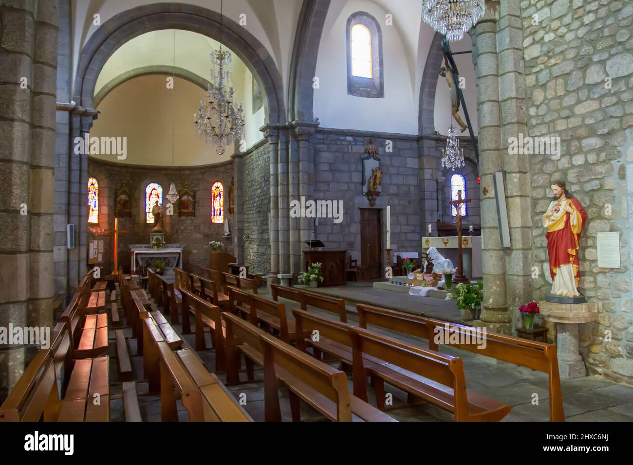 interior of a church with statues and stained glass windows Stock Photo ...