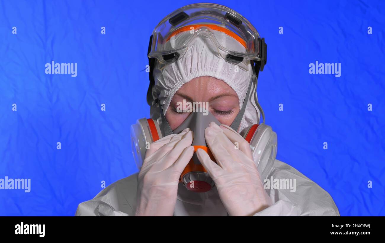 Scientist virologist in respirator. Slow motion. Woman close up look ...