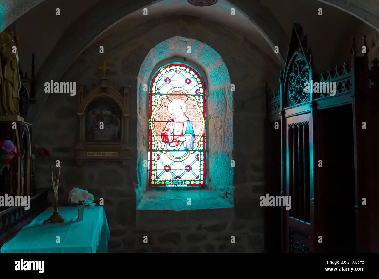 interior of a church with statues and stained glass windows Stock Photo ...