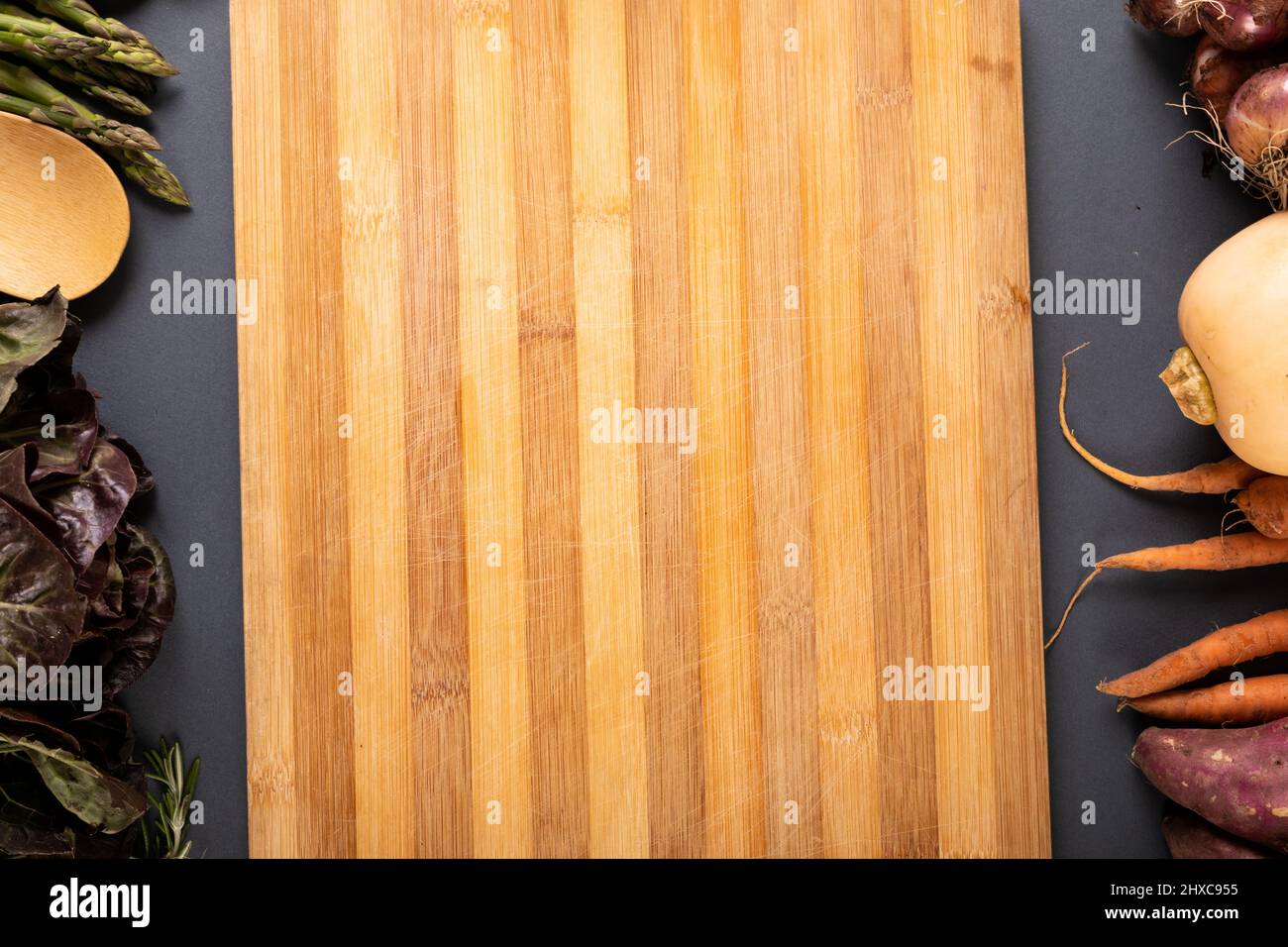 Overhead close-up of wooden cutting board with copy space and ...