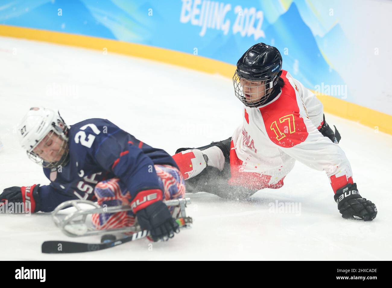 Beijing, China. 11th Mar, 2022. Shen Yifeng (R) of China vies with Josh ...