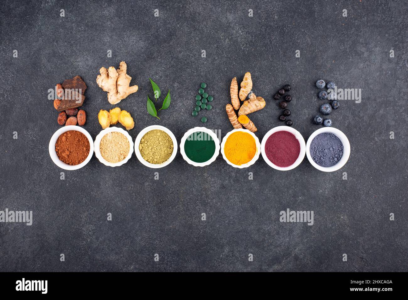 Various healthy superfoods powder Stock Photo - Alamy