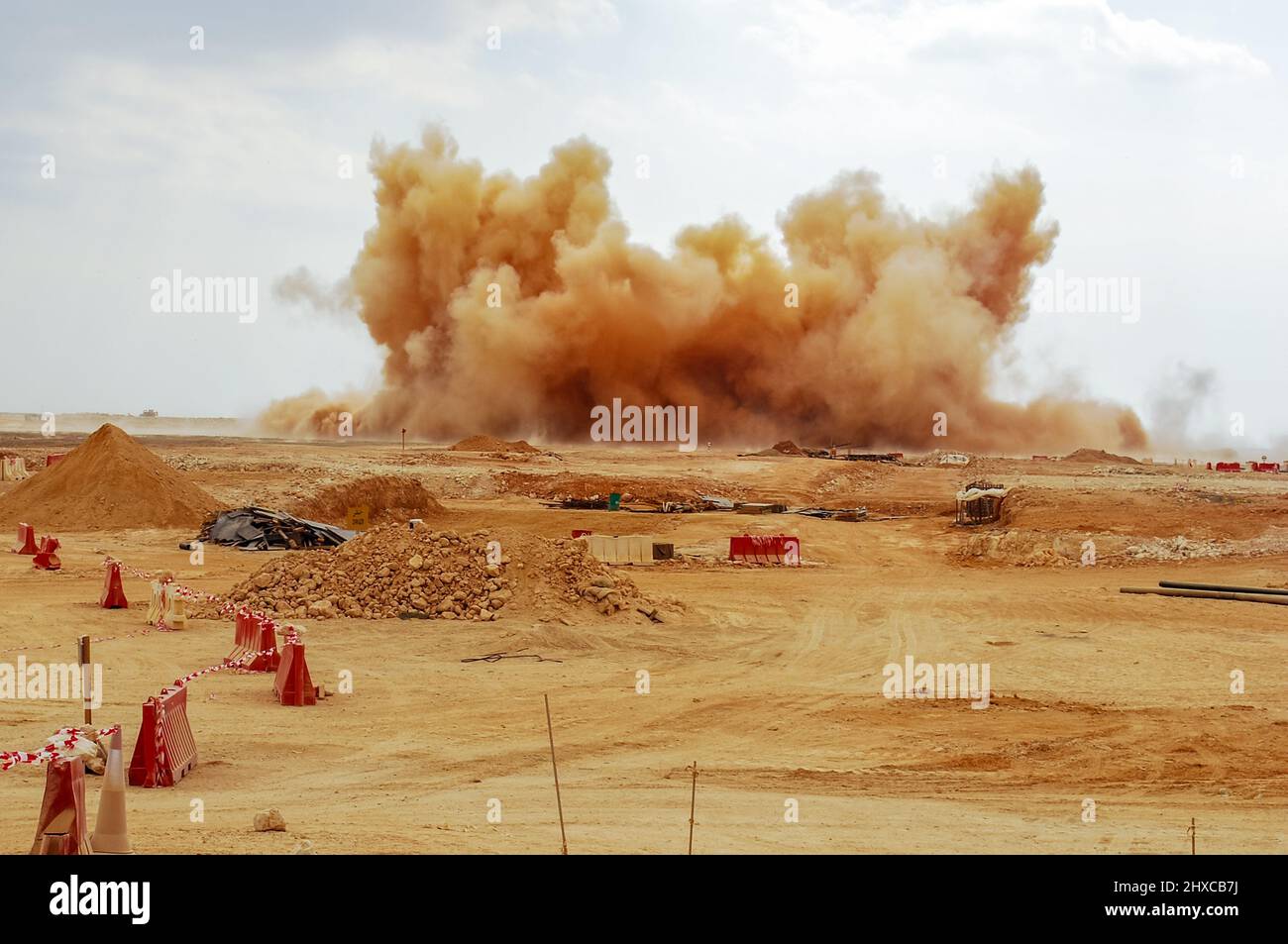 Rock dust storm after denotator blasting in the Arabian desert Stock ...