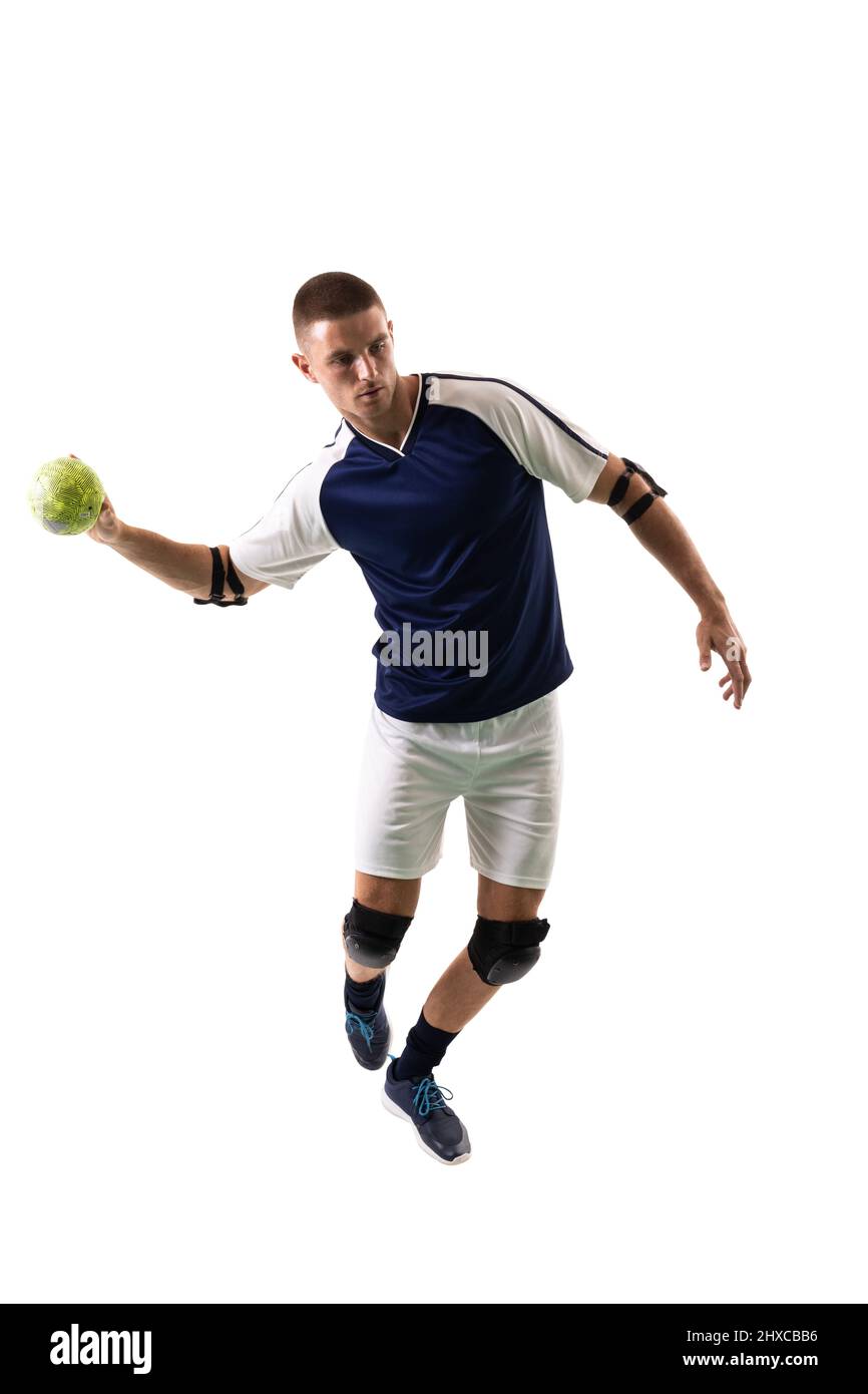 Full length of young male caucasian athlete playing handball while ...