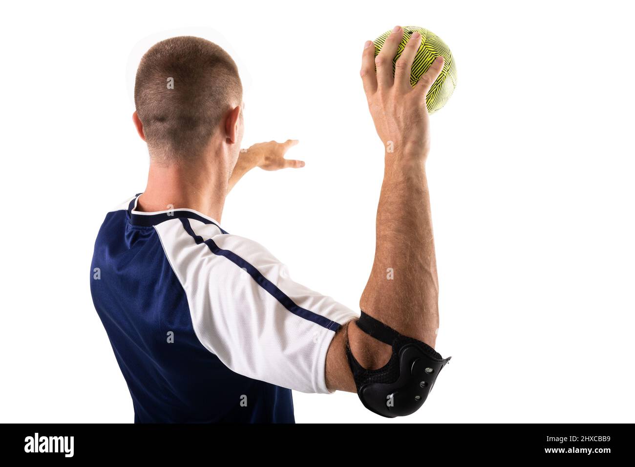 Young male caucasian athlete wearing elbow guard playing handball on ...