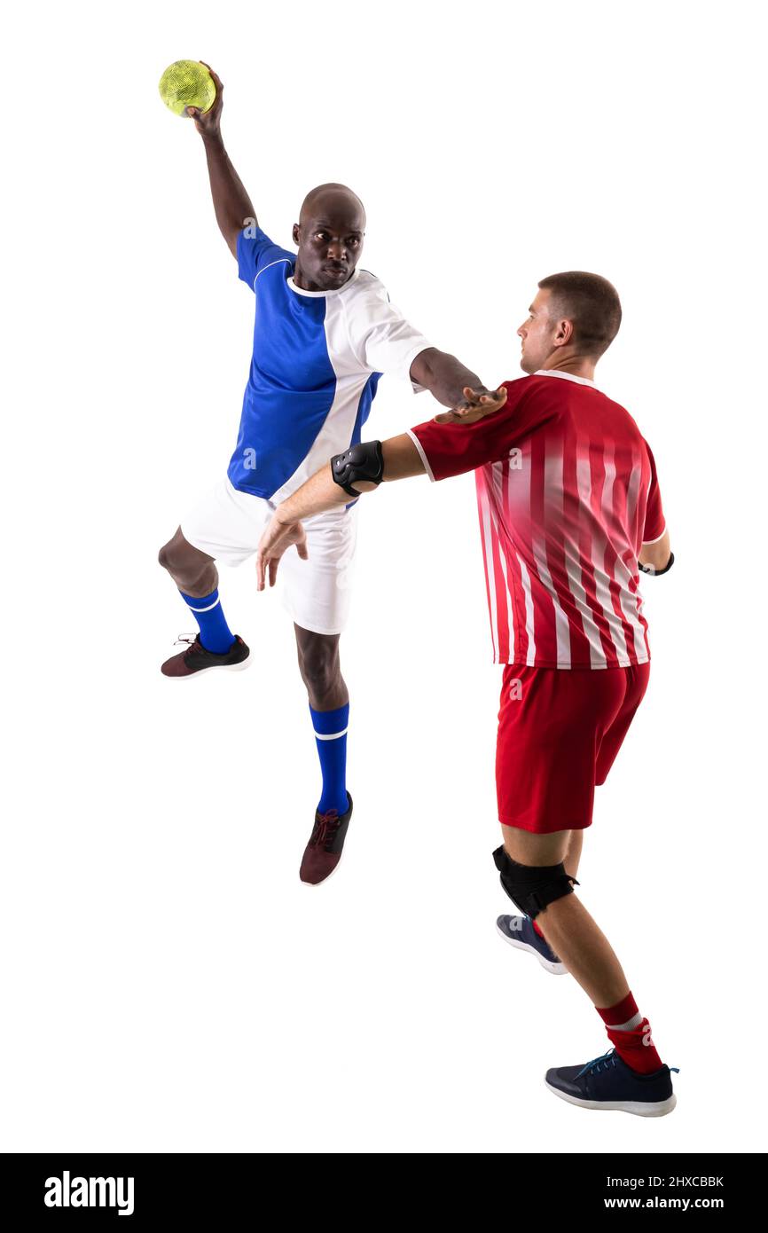 Young multiracial male players playing handball against white ...