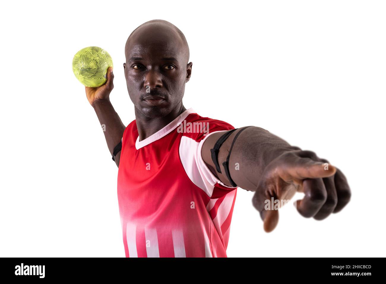Confident young male african american male handball player throwing ...