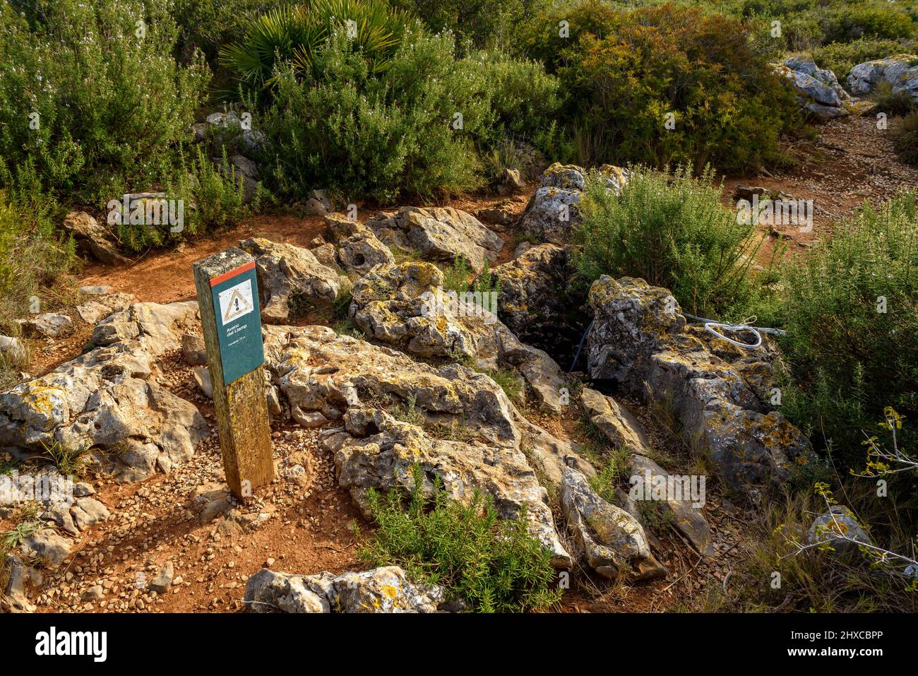 Pit cave of the Avenc del Llamp, 73 meters deep in the limestone rock ...