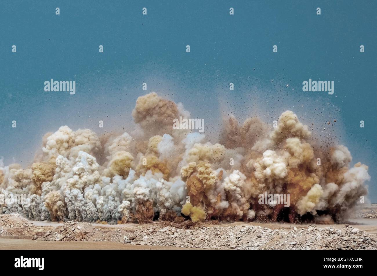 Rock and dust clouds during detonator blast on the mining site Stock ...