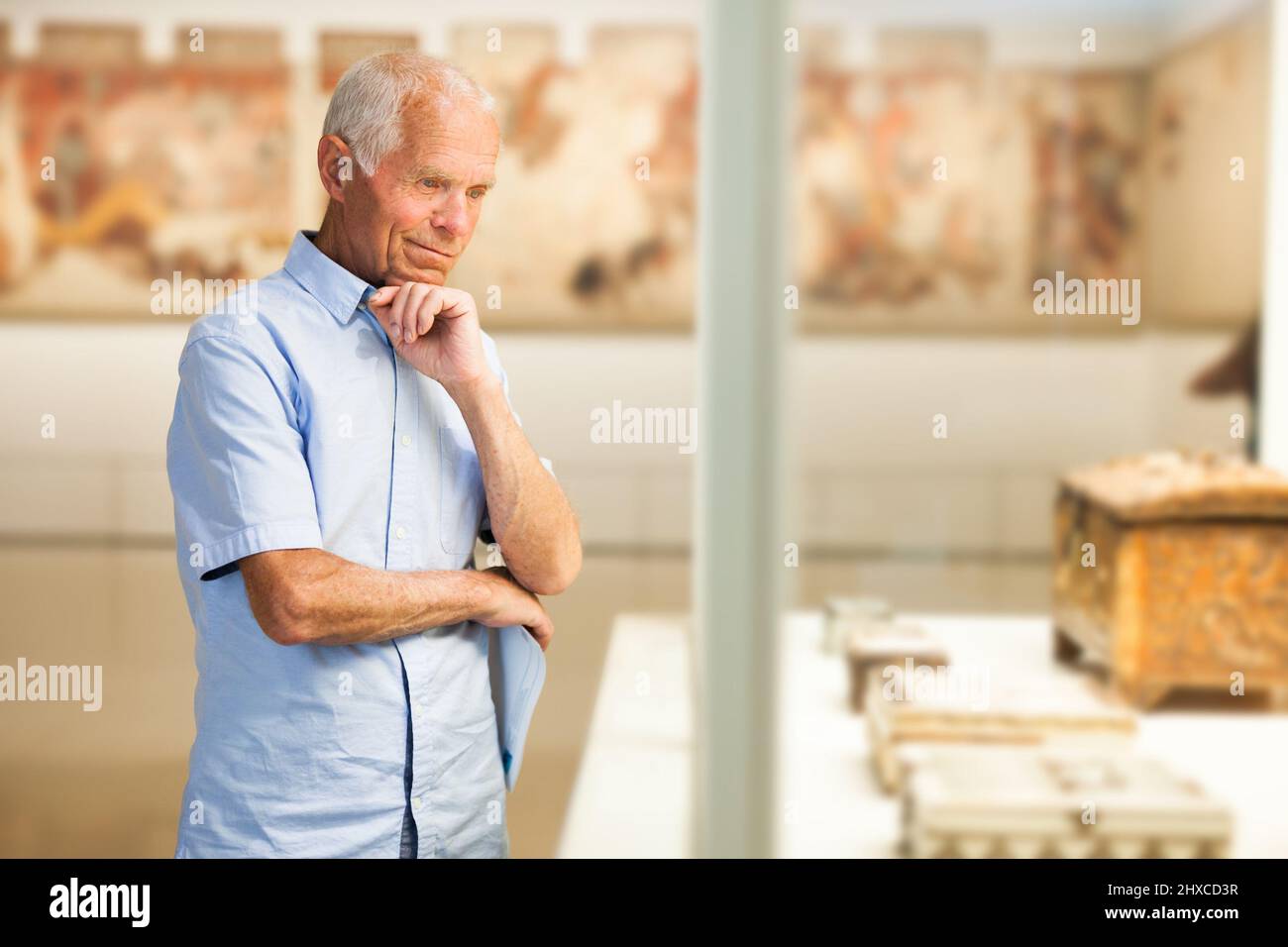 Man exploring artworks in museum Stock Photo - Alamy