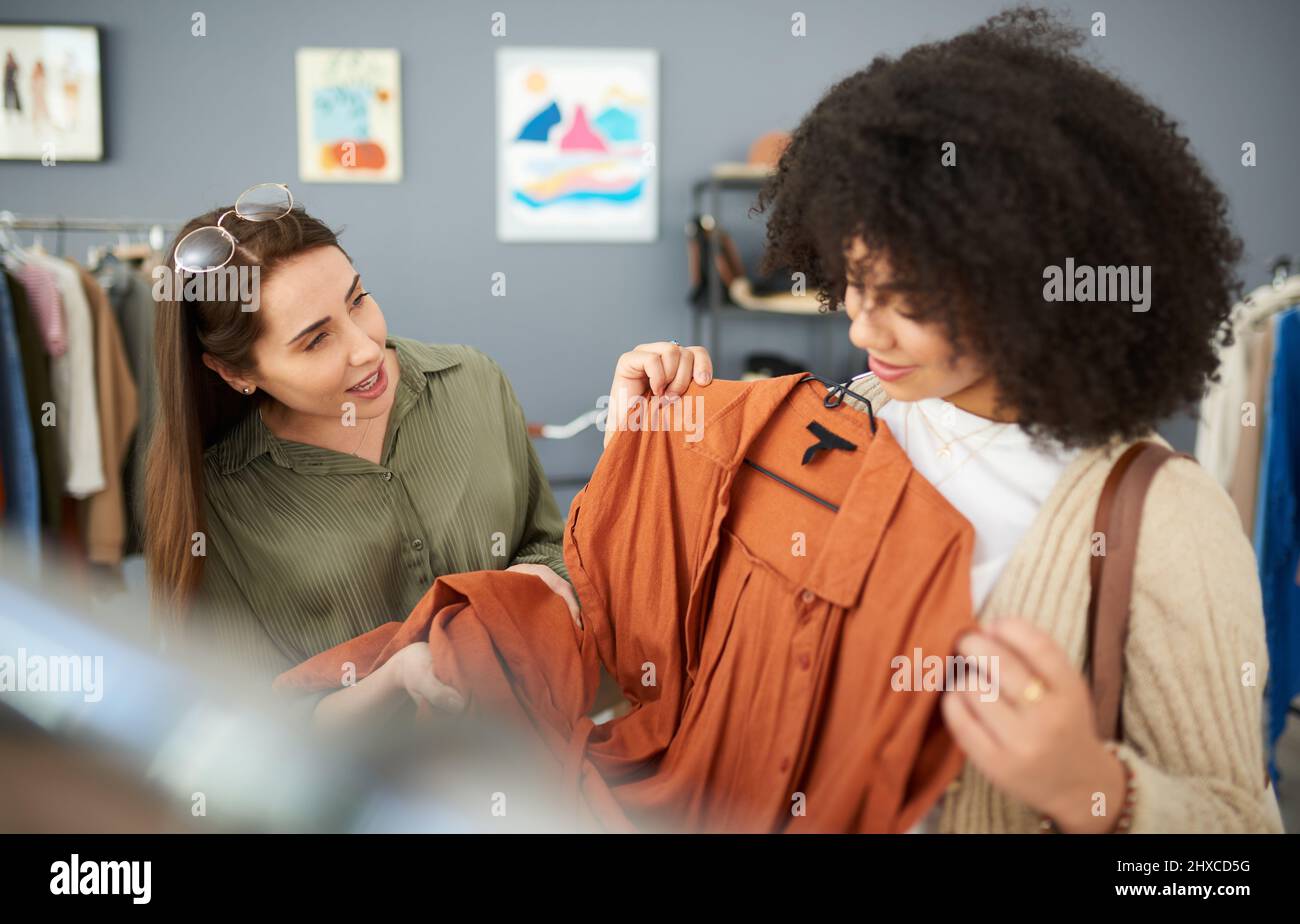 Women talking to shop assistant hi-res stock photography and images - Alamy
