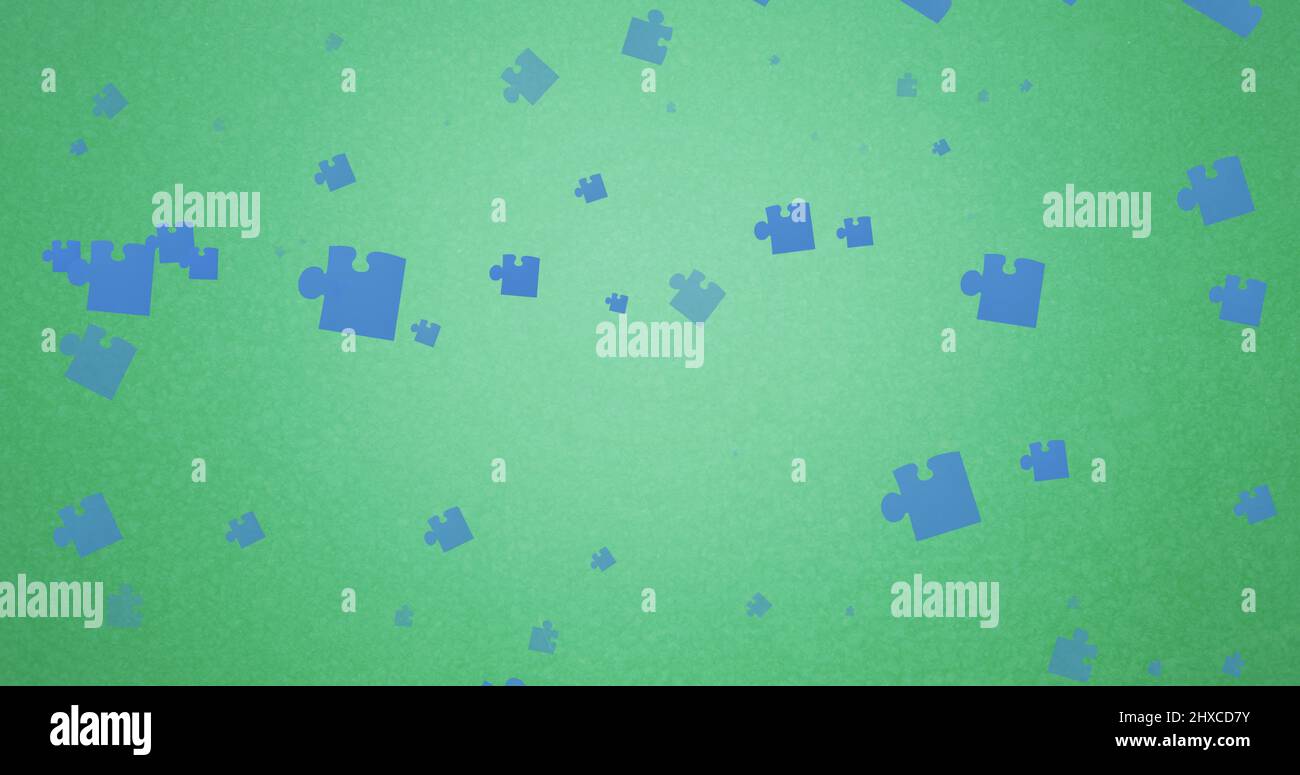 Image of blue pieces of puzzle falling on green background Stock Photo ...