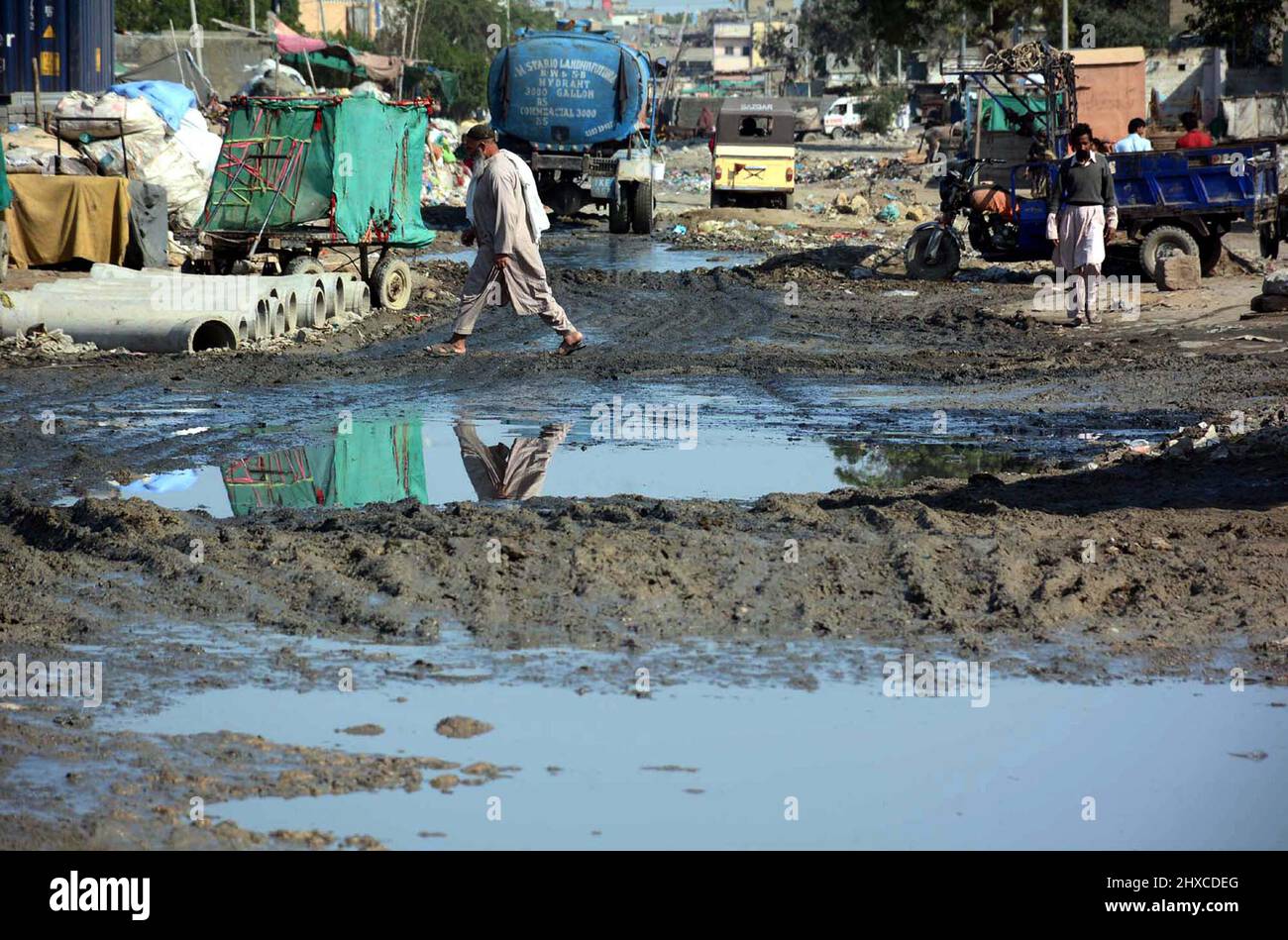 Inundated road by overflowing sewerage water creating problems for ...