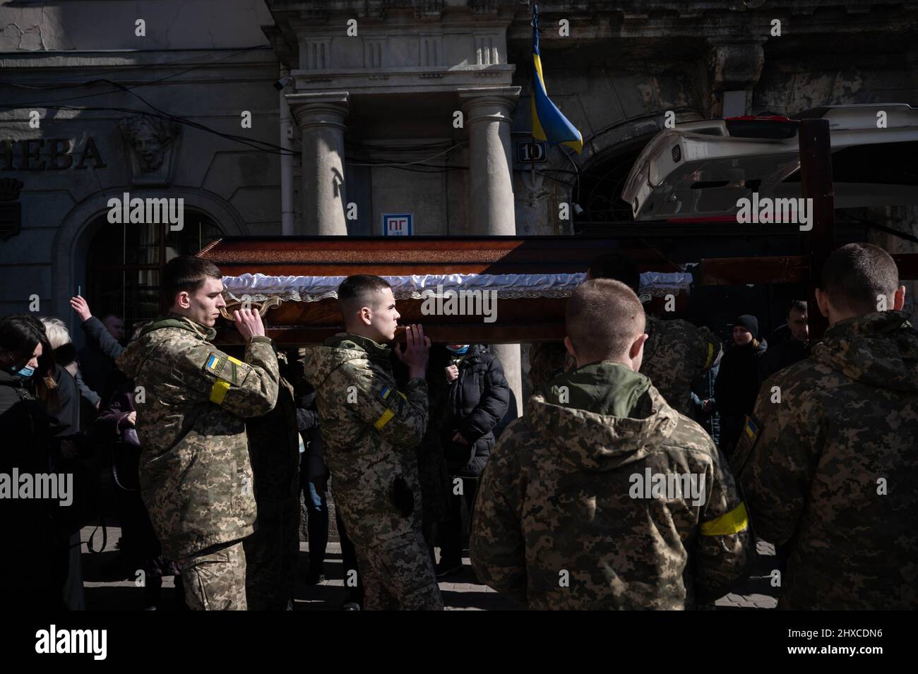 Lviv, Ukraine. 11th Mar, 2022. Ukrainian soldiers carry the coffin of ...