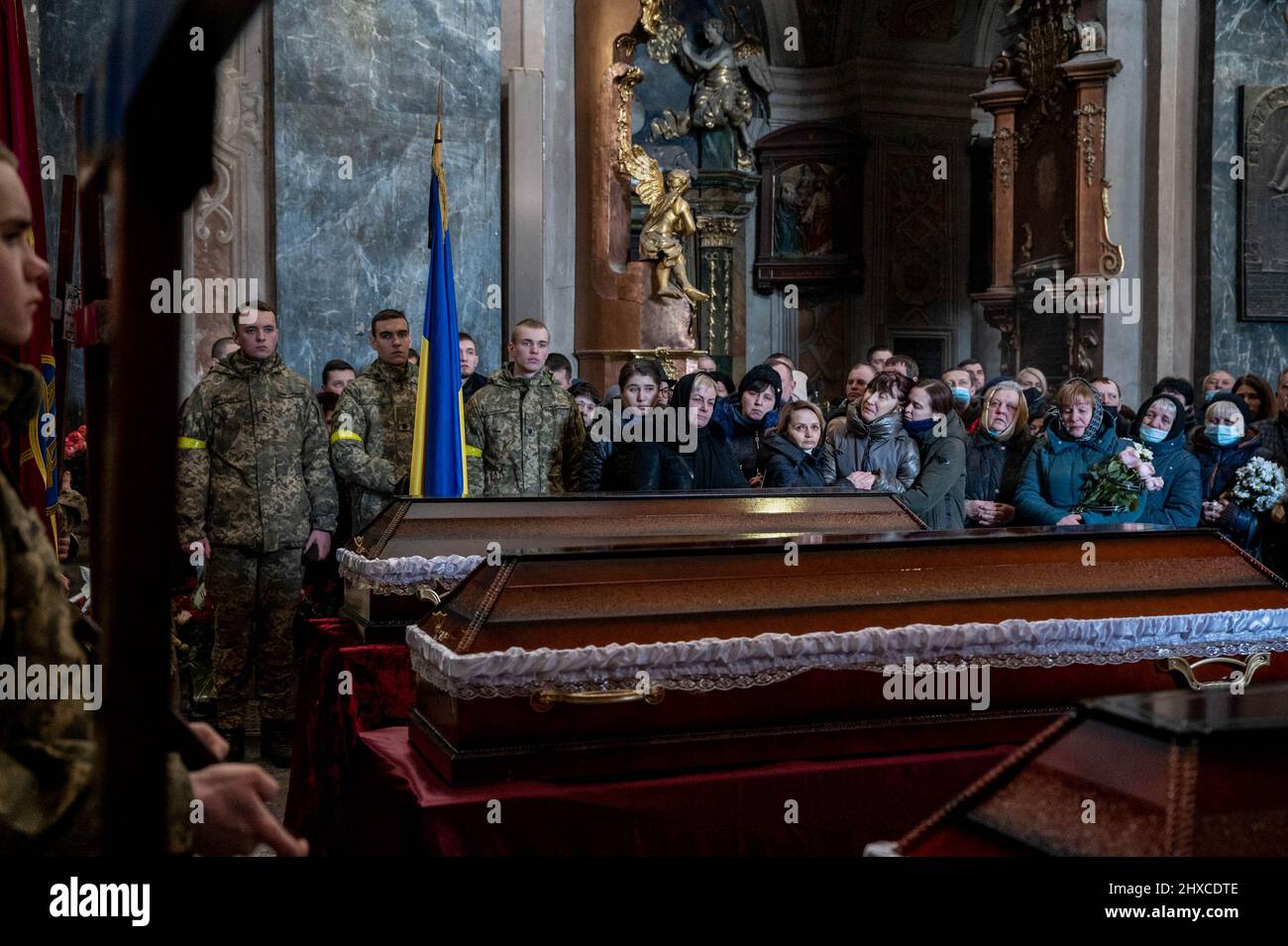 Lviv, Ukraine. 11th Mar, 2022. Ukrainian soldiers and families pay ...