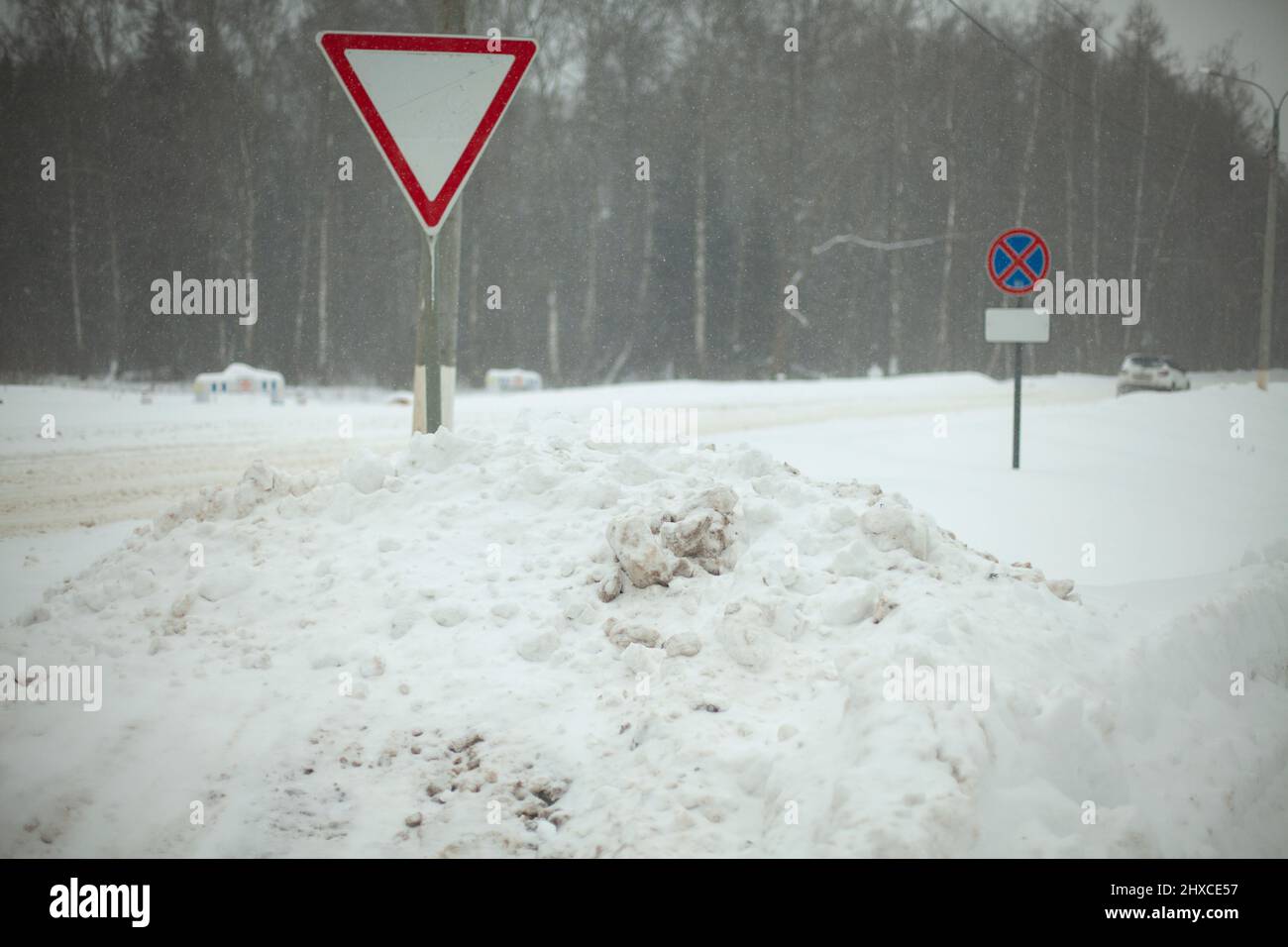 Snowstorm on road. Snow drifts on track. Snowdrift at highway exit ...