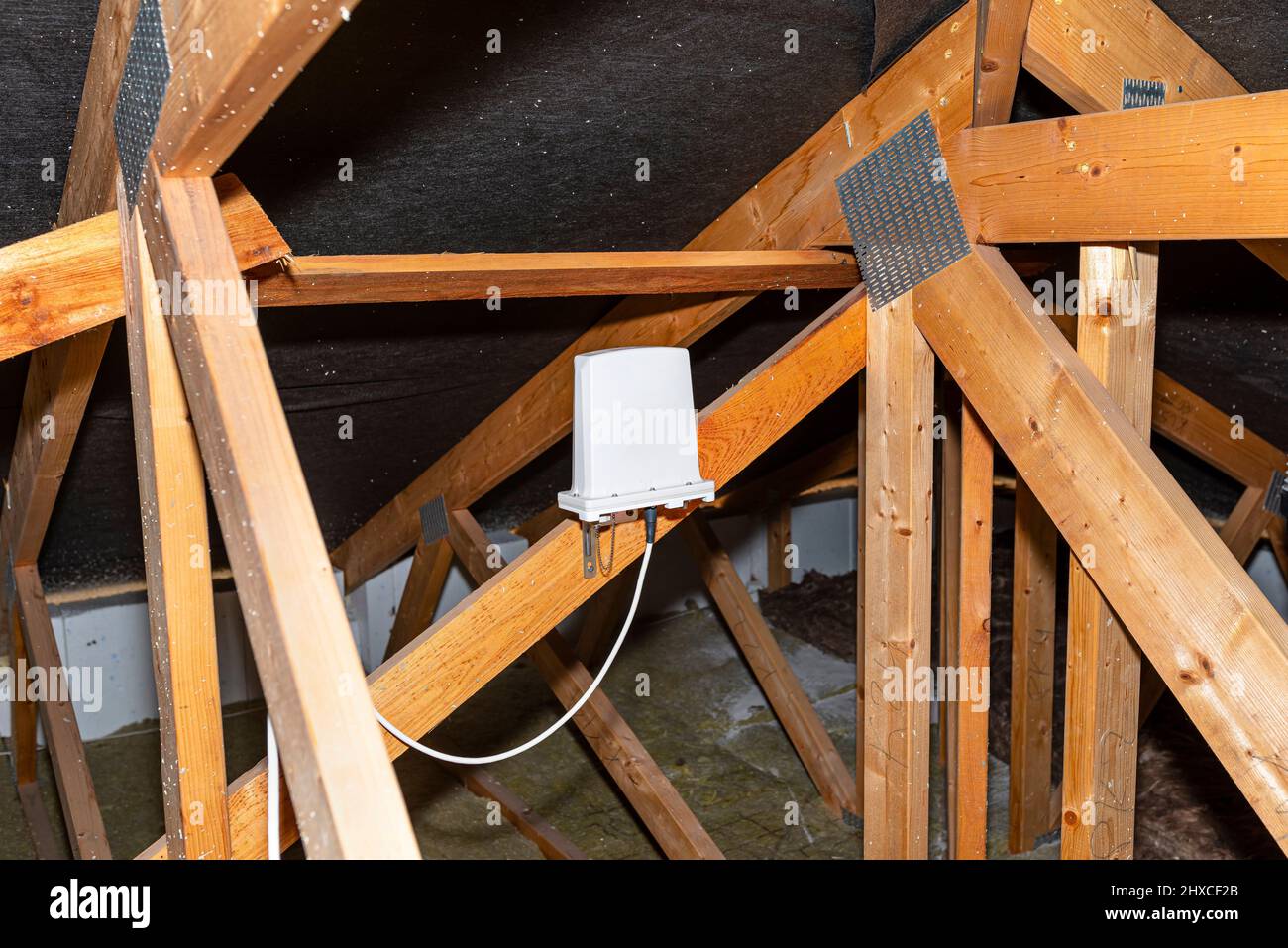 Antenna amplifier for mobile internet at home, mounted on roof trusses ...