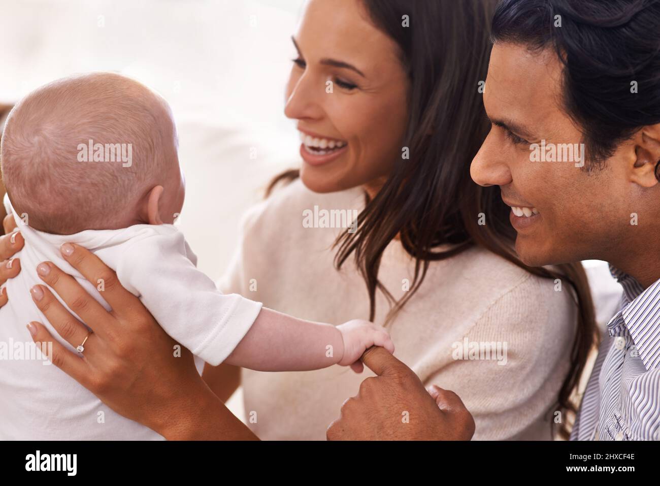 The newest addition to the family. Cropped shot of an affectionate ...