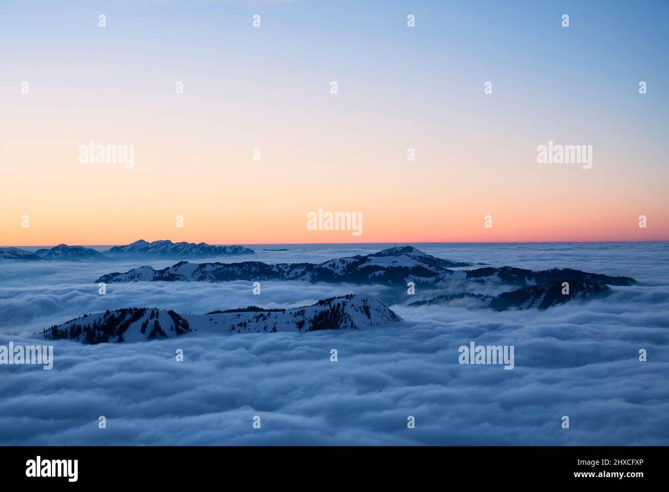 Snowy mountains after sunset above clouds allgau alps bavaria hi-res stock photography and ...