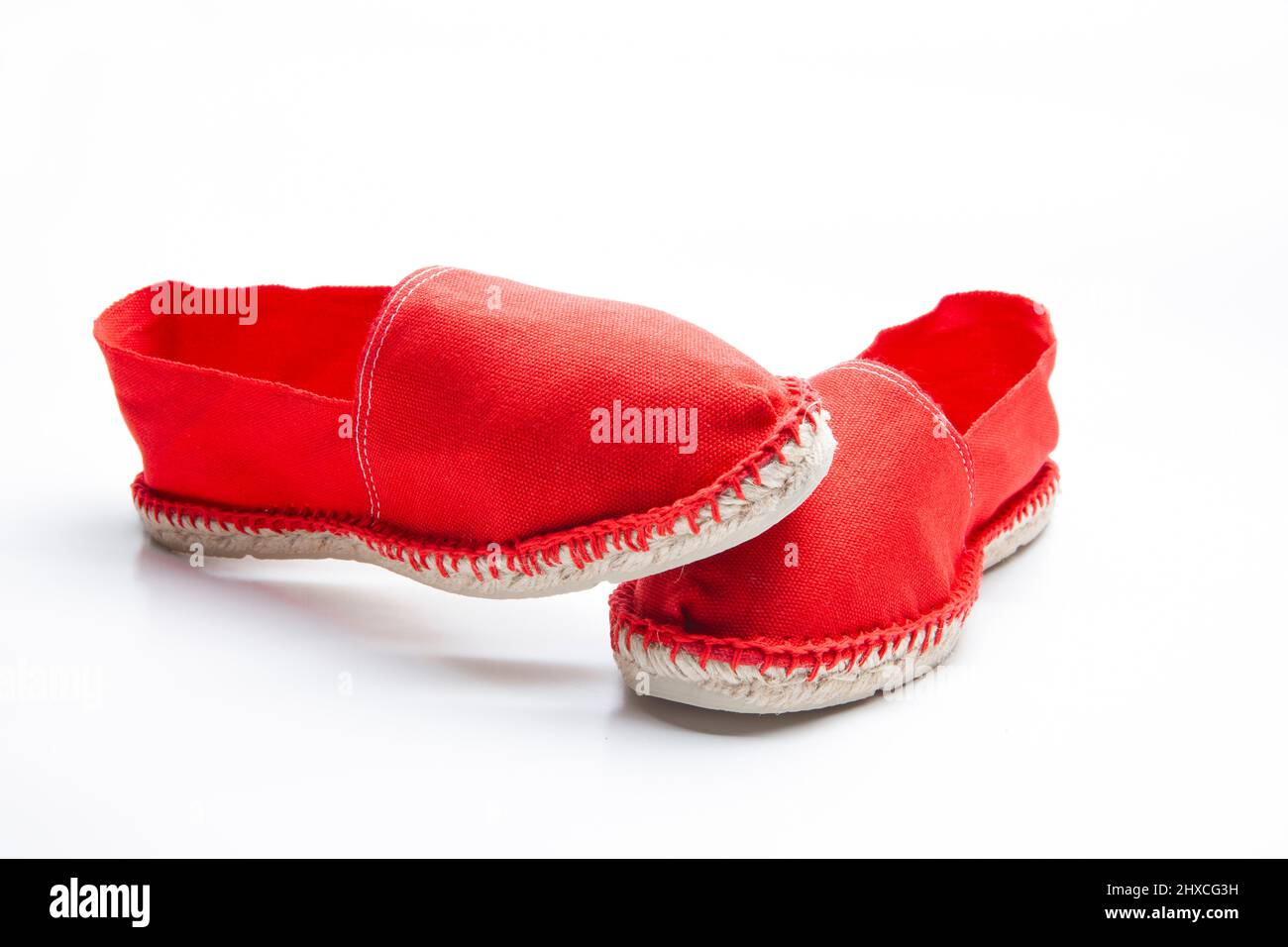 Red fabric shoes isolated on white background Stock Photo - Alamy