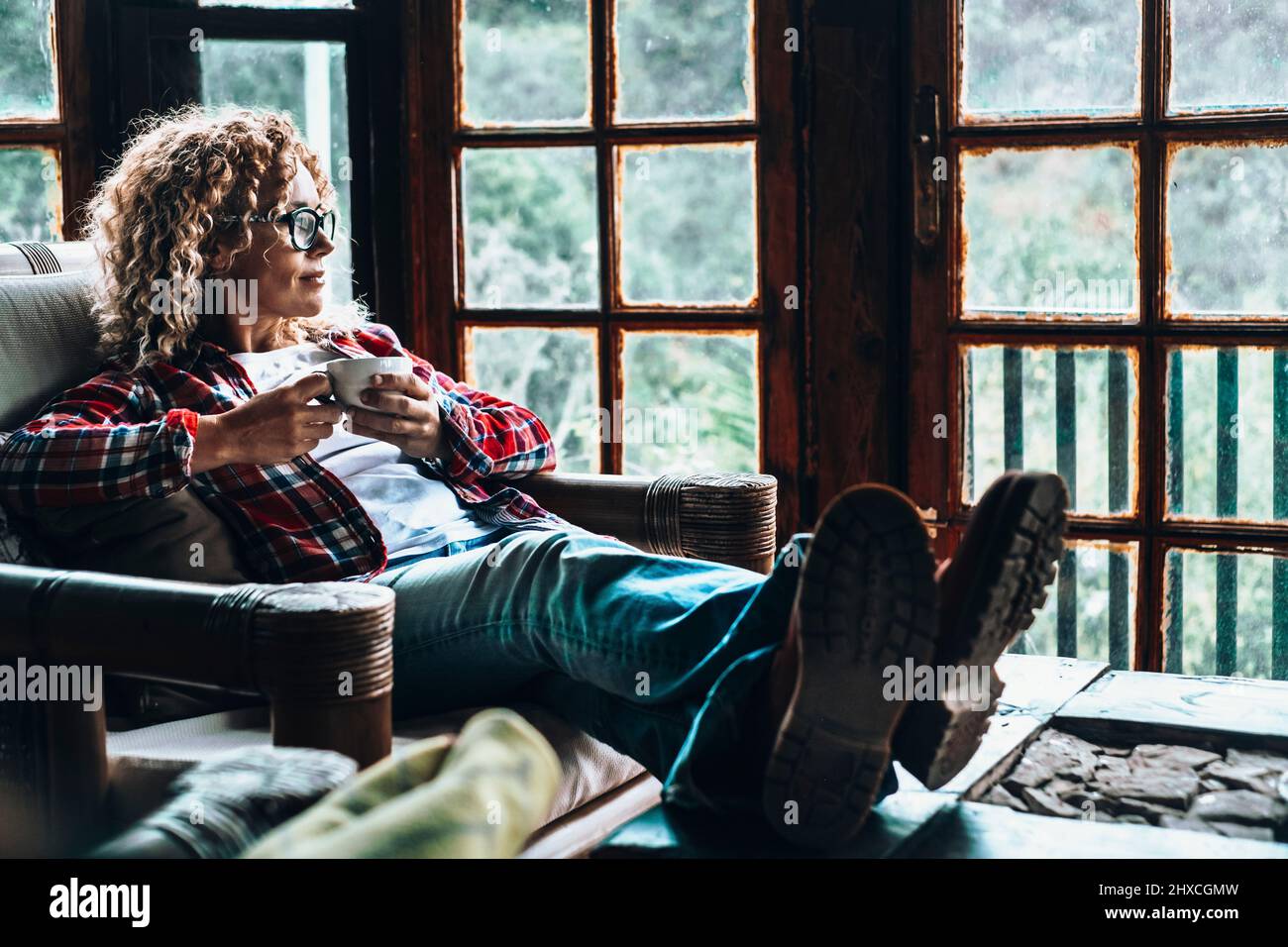 Woman legs up chair hi-res stock photography and images - Alamy