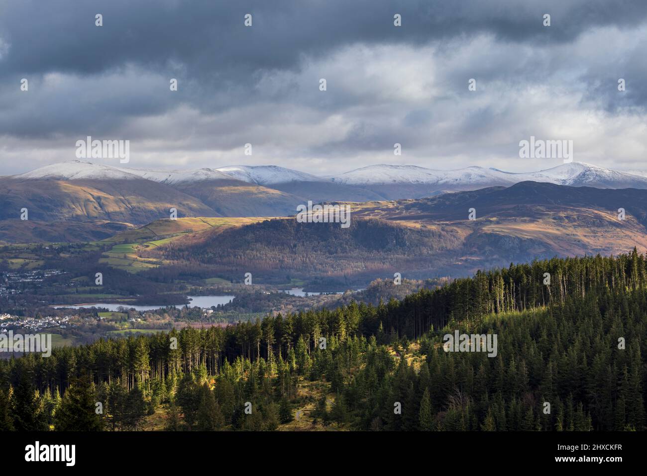 Keswick and Derwent Water from the Whinlatter Forest with snow covered ...